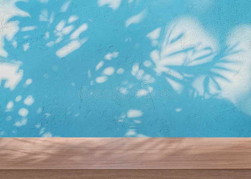 Empty Board or Table Top and Blue Stucco Pattern Wall with Leaf Shadows ...