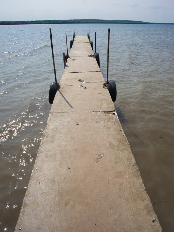 Empty boat dock stock image. Image of trees, white, dock - 76491455