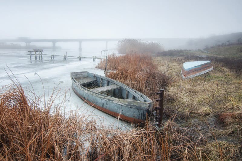 An Empty Boat is Lying on the River Bank in Winter Stock Image - Image ...