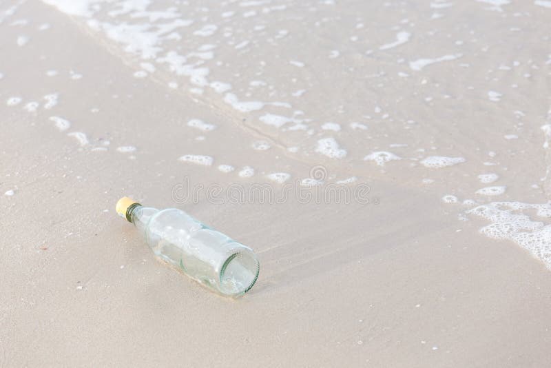 Empty bottle on the beach stock photo. Image of nature - 186003568