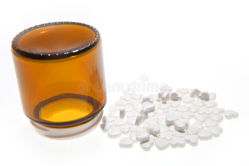 A Bottle and a Bunch of Love Pills Isolated on the White Stock Photo ...