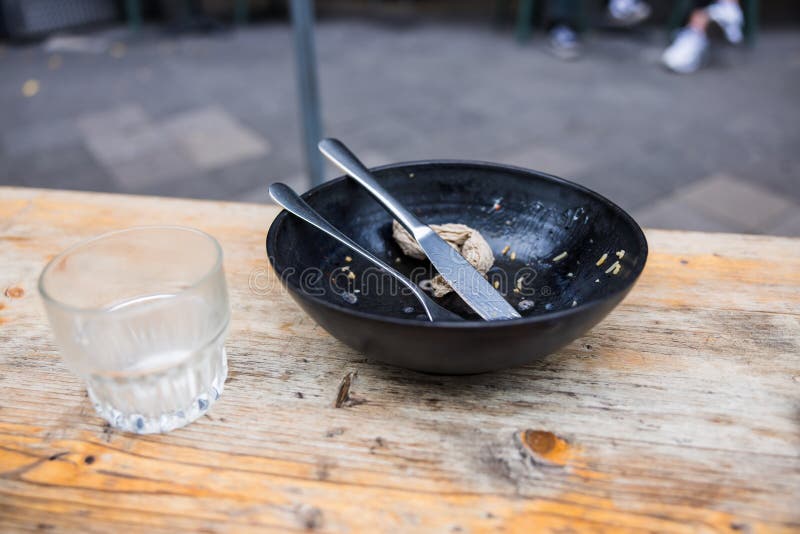 Almost Empty Bowl and Empty Water Glass Left by a Customer after Eating ...