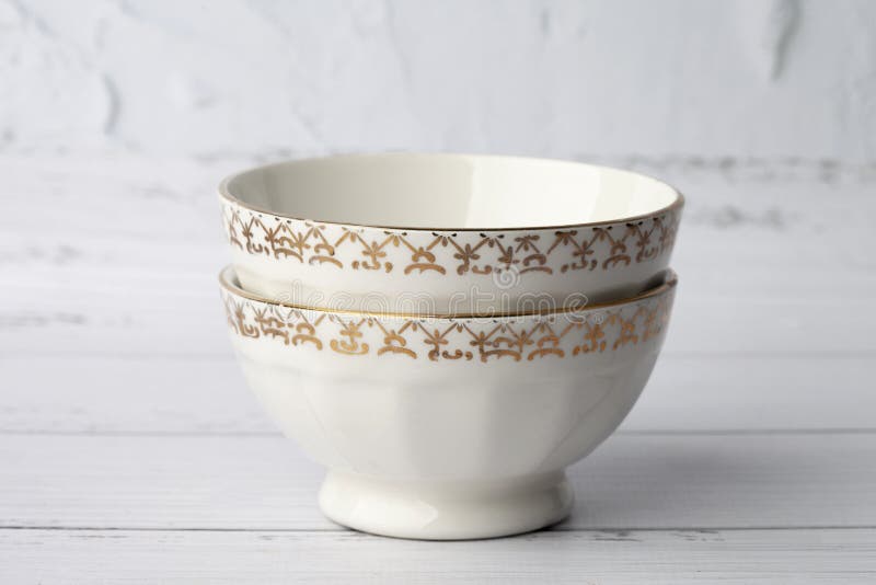 Empty Bowl on a White Background. Two White Porcelain Bowls with a Gold ...