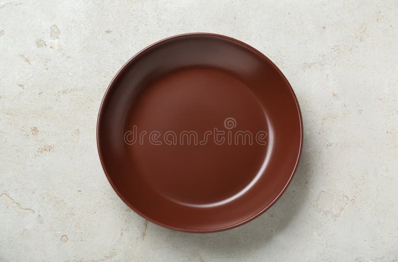 Empty Brown Ceramic Plate on Light Grey Table, Top View Stock Photo ...