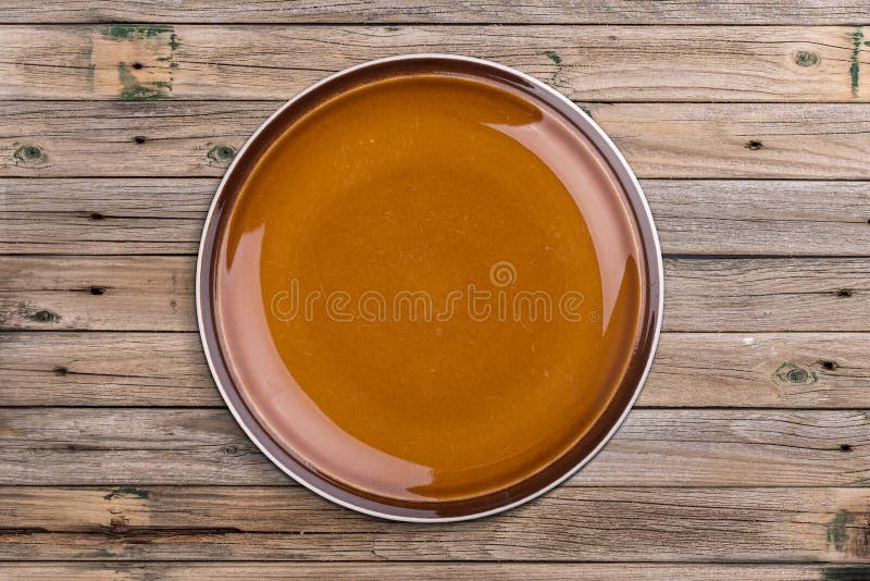 Empty brown plate stock image. Image of vintage, wood - 53674363