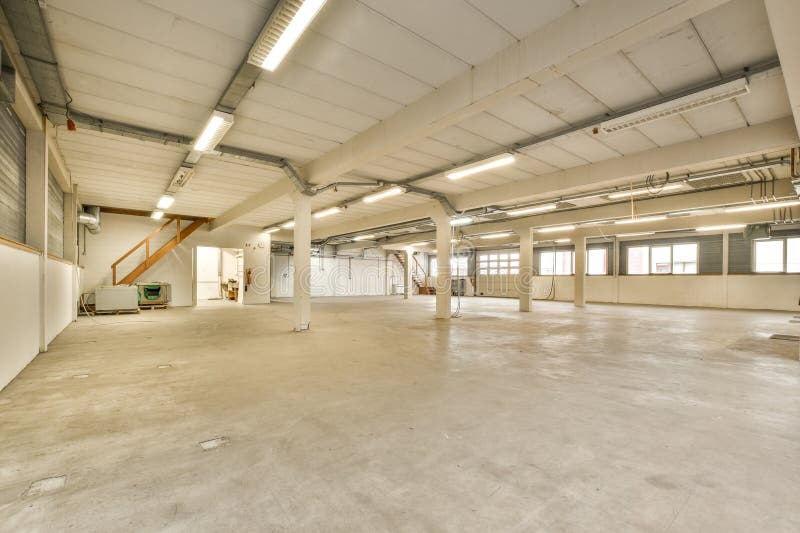 The Inside of a Large Building with a Concrete Floor Stock Image ...
