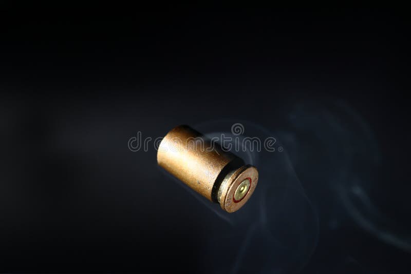 Empty Bullet Shell Casings, on a Black Background, Smoke Stock Photo ...