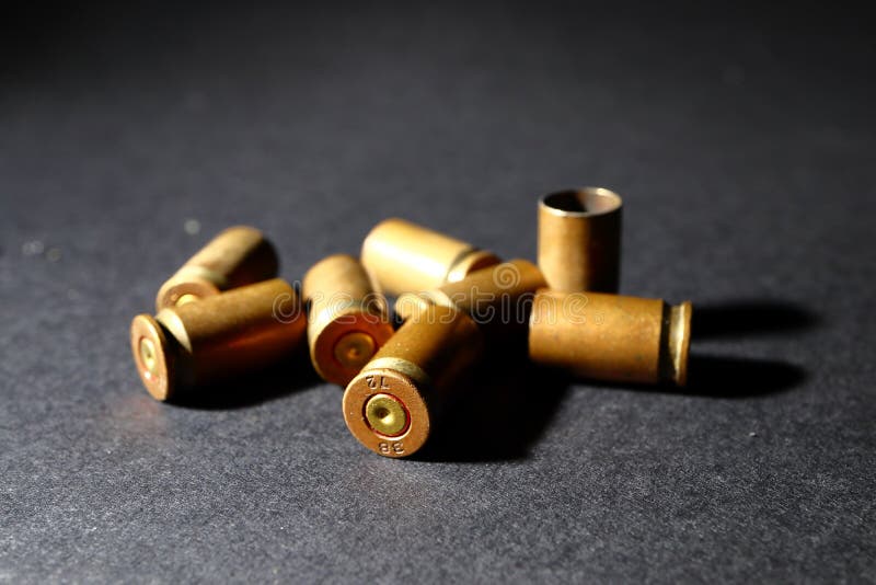 Empty Bullet Shell Casings, on a Black Background, Smoke Stock Photo ...