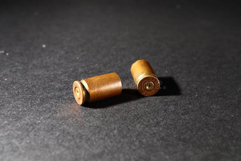 Empty Bullet Shell Casings, on a Black Background, Smoke Stock Image ...