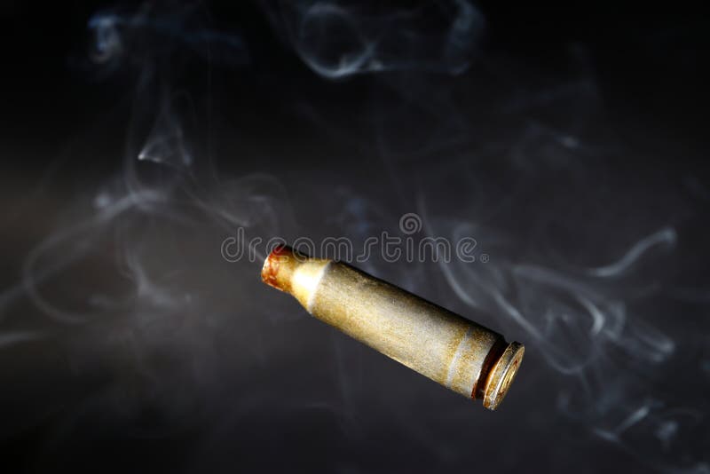 Empty Bullet Shell Casings, on a Black Background, Smoke Stock Photo ...
