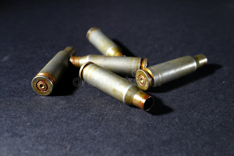Empty Bullet Shell Casings, on a Black Background, Smoke Stock Photo ...