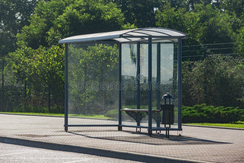 Empty bus stop by the park stock image. Image of transportation - 299901981