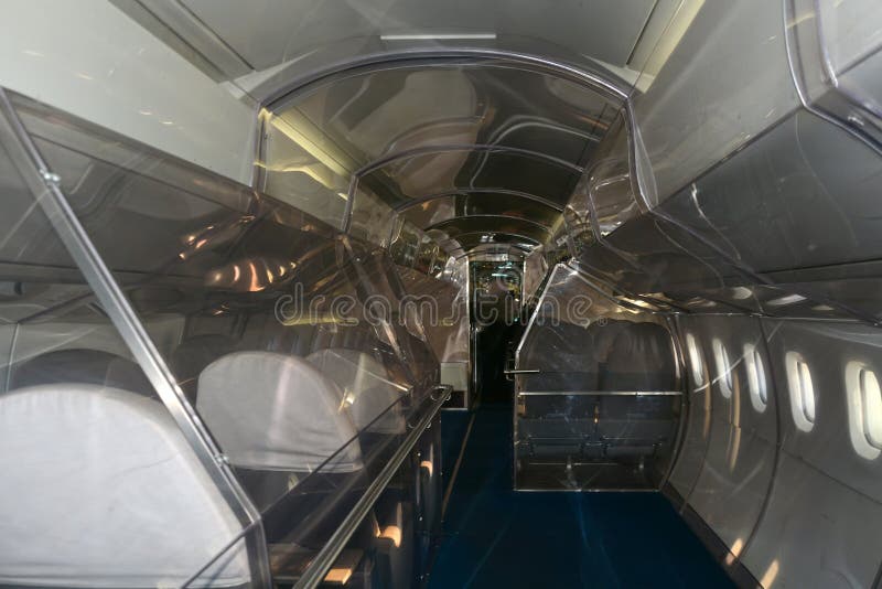 Empty Cabin of a Passenger Plane from the Inside with Rows of Seats in ...