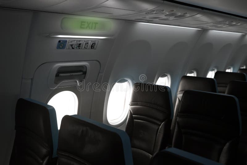 Cabin of a Passenger Plane with a View of the Emergency Exit Stock ...