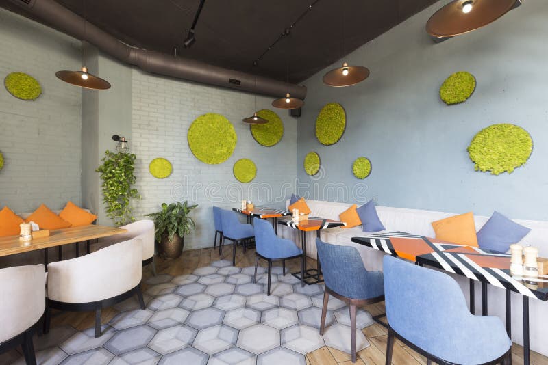 Empty Cafe Interior with Lots of Greenery on Walls Stock Photo - Image ...