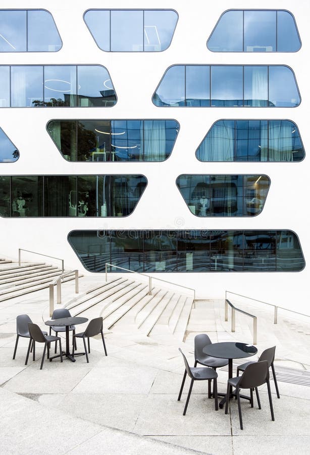 Empty Cafe Tables in Front of Modern Office Building Stock Photo ...