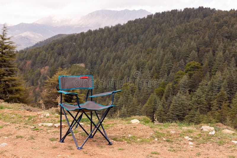 Empty Camping Chair with Cedar Forest View Stock Image - Image of ...