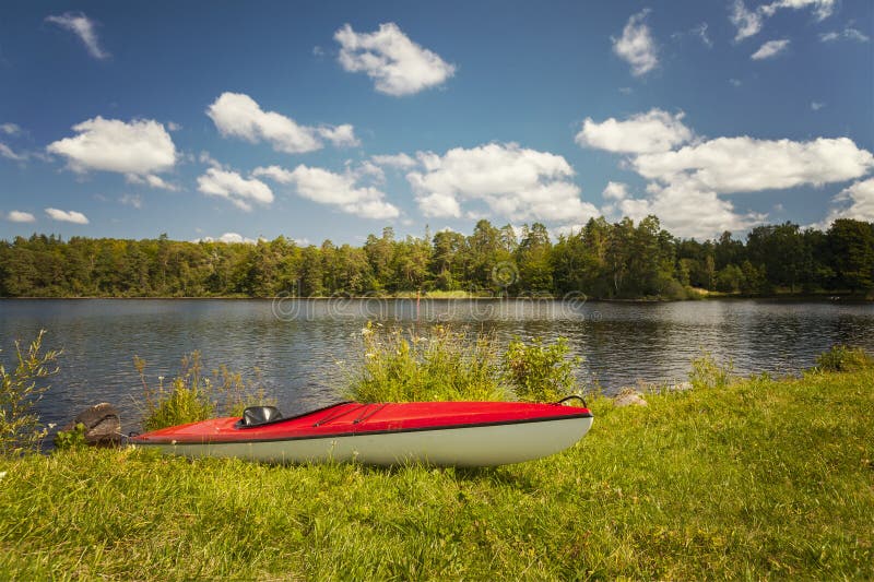 Empty canoe by lake stock photo. Image of paddling, peace - 77600262