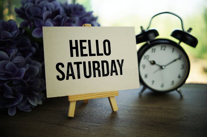 Hello Saturday Text Message with Wooden Easel and Alarm Clock on Wooden ...