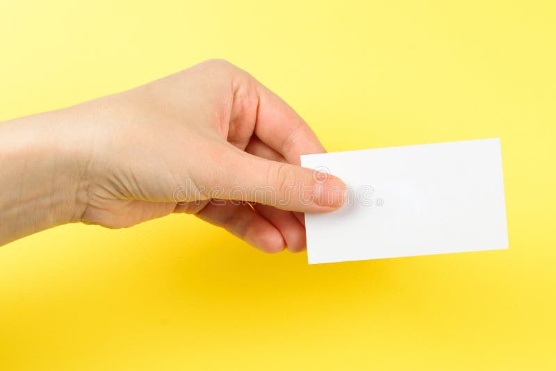 Empty Card in Woman Hand on a Yellow Background Stock Photo - Image of ...