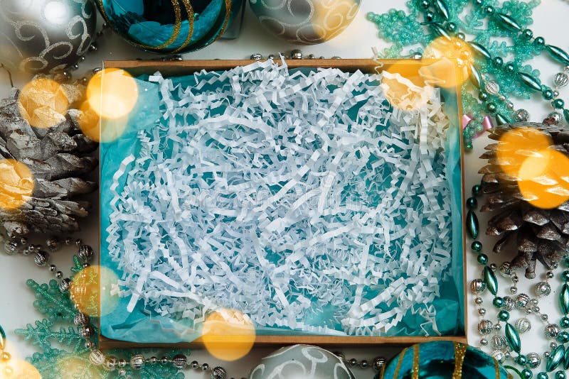 An Empty Cardboard Box with a Blue Backing and White Paper Filling ...