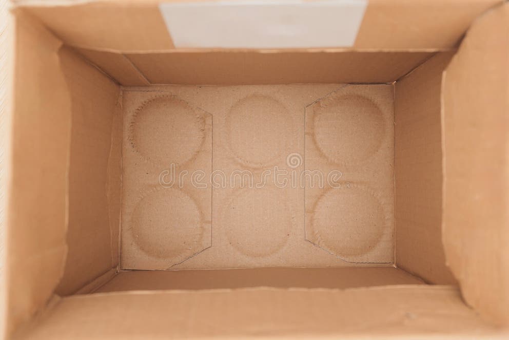 An Empty Cardboard Box that Comes with Circular Inserts Designed for ...