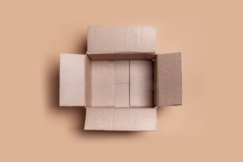 Empty Cardboard Box for Packing Parcels on a Brown Background Stock ...