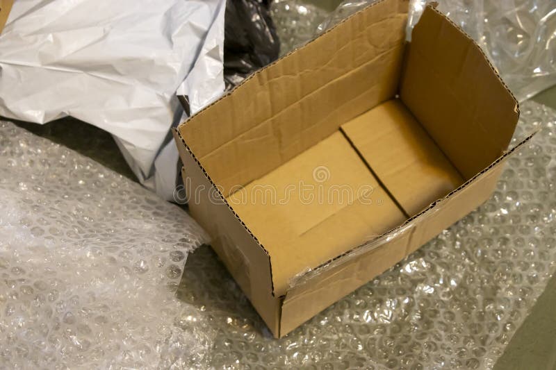 An Empty Cardboard Box Surrounded by Packing Materials, Symbolizing ...