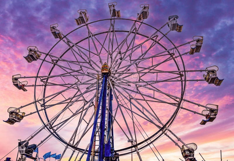Empty Carnival Ferris Wheel Against Colorful Sunset Sky Stock Photo ...