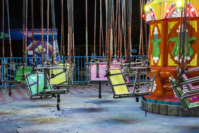 Empty Carousel Metal Seat. Amusement Park Concept in a City Park Stock ...