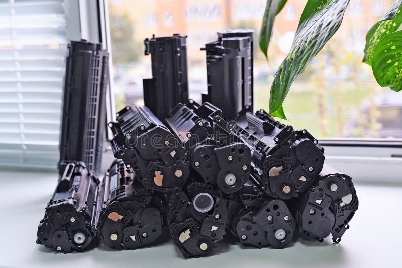 Empty Cartridges from the Printer Stacked on the Windowsill of the ...