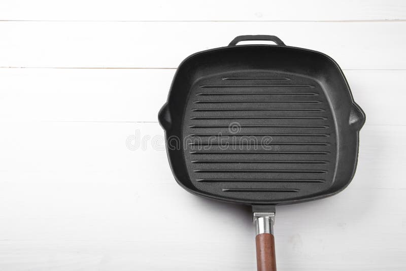 Empty Cast-iron Grill Pan on a White Wooden Background Stock Image ...