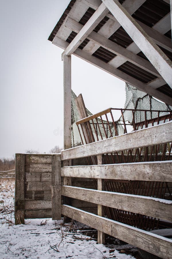 Empty Cattle Paddock in the Foreground with a Hay Feeder Stock Image ...