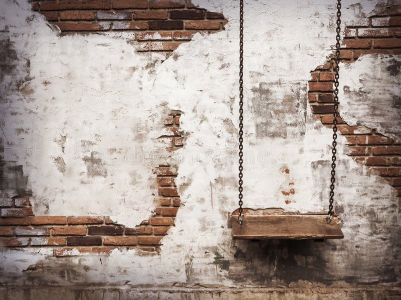 Empty Chain Swing Against Old Brick Wall Background Stock Photo - Image ...