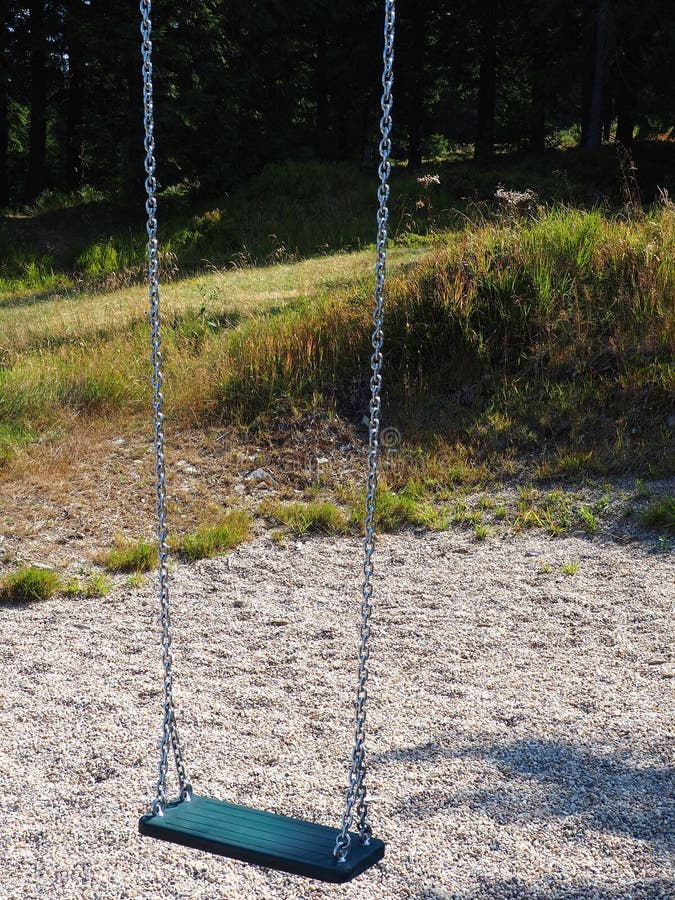 Empty Chain Swing in Playground. Nobody Sit on Swing in Playground ...