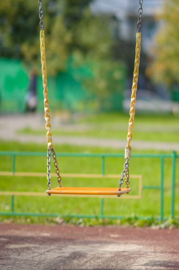Empty Chain Swings on Summer Kids Playground Stock Photo - Image of ...