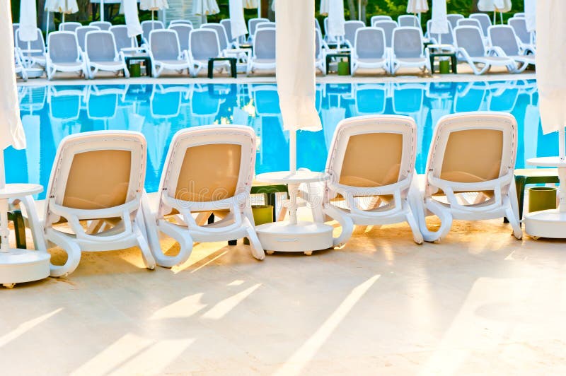 Empty Chairs Stand Around the Pool at the Hotel Stock Image - Image of ...