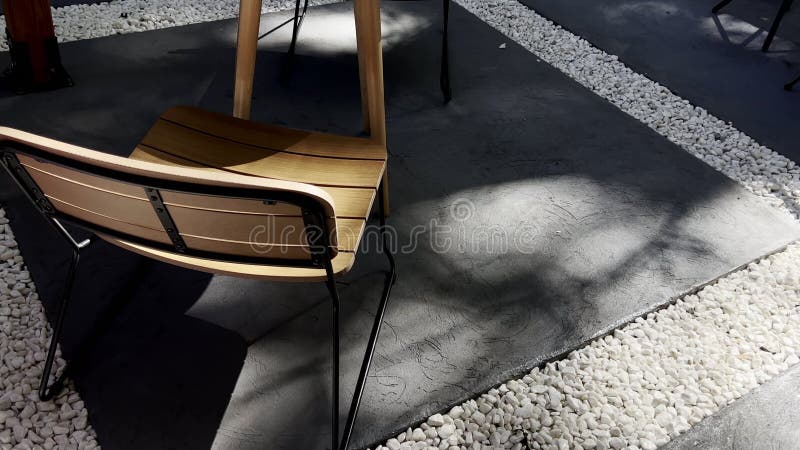 Empty Outdoor Cafe: Sunlight and Shadows on Modern Furniture Stock ...