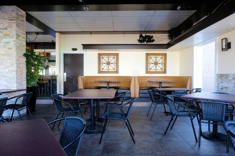 Empty Chairs and Tables in a Restaurant Dining Room Editorial ...