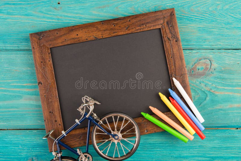 Empty Chalkboard with Copyspace and Colorful Crayons on Wooden Table ...