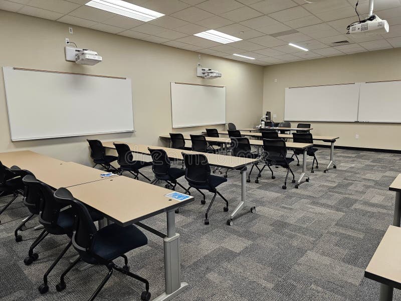 Empty Classroom Interior, with Rows of Desks and a Projector Suspended ...