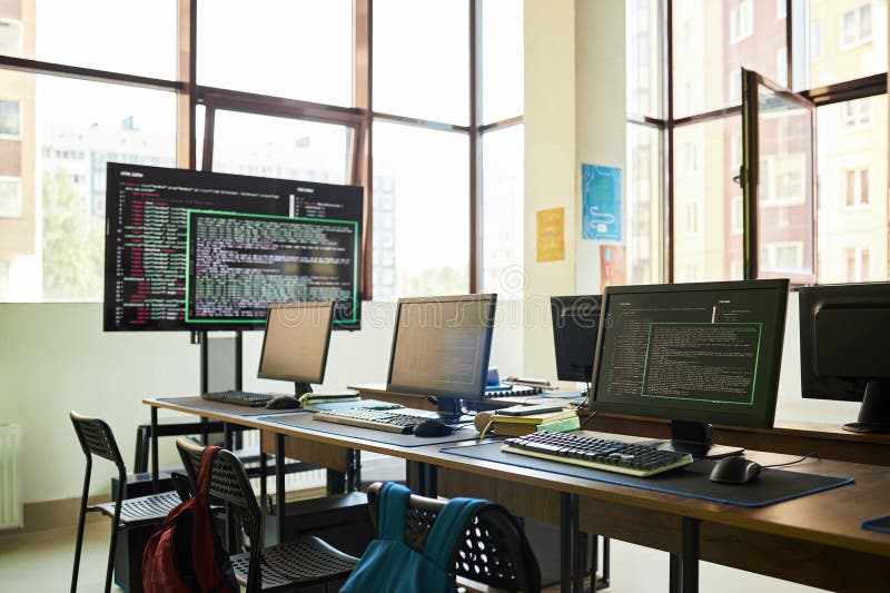 Empty Computer Classroom Featuring Multiple Monitors Displaying Programming Code Stock Photo ...