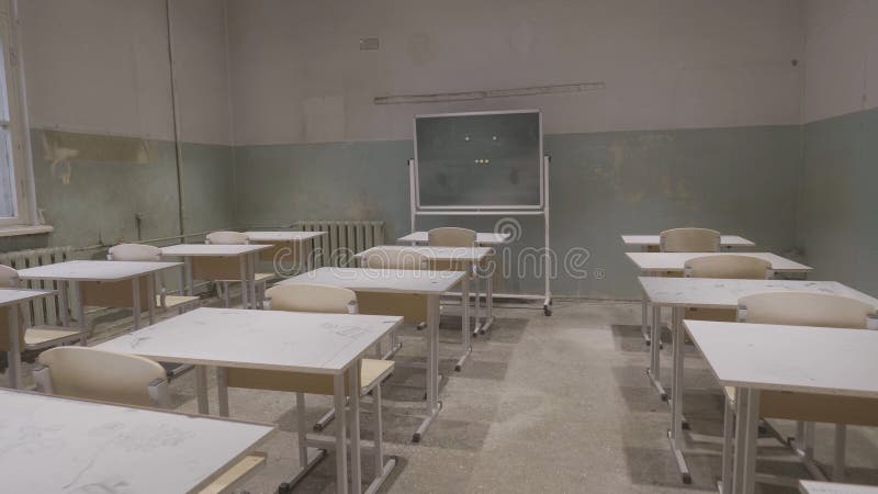 Empty Classroom with Wooden Desks, White and Green Chalk Boards in ...