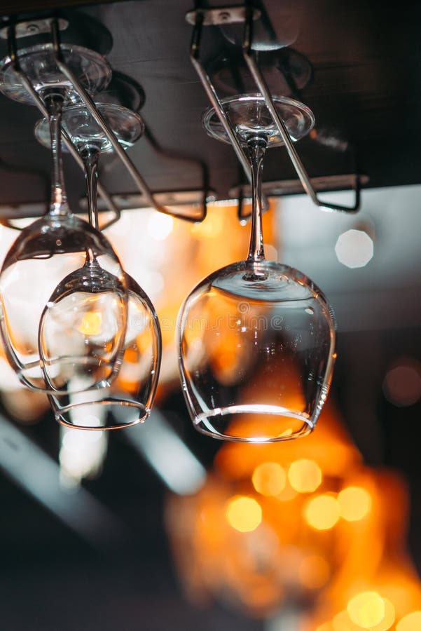 Empty Clean Drink Glasses Hang on a Bar Counter. Blurred Background ...
