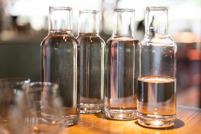 Empty Clean Glass Decanters for Water in a Restaurant on a Bar Counter ...