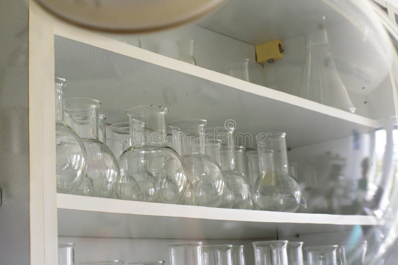 Empty Clean Laboratory Glassware.many Flasks on the Shelves of Wall ...