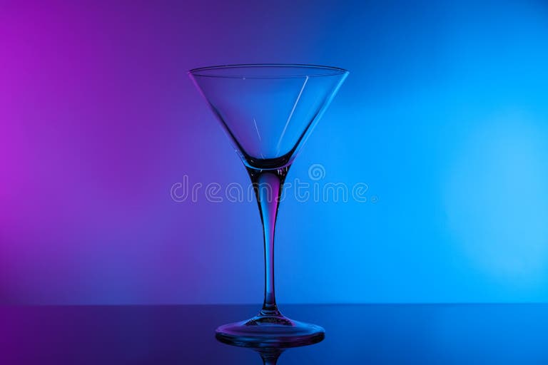 Empty Clean Martini Glass on Mirror Table in Neon Lights Stock Photo ...