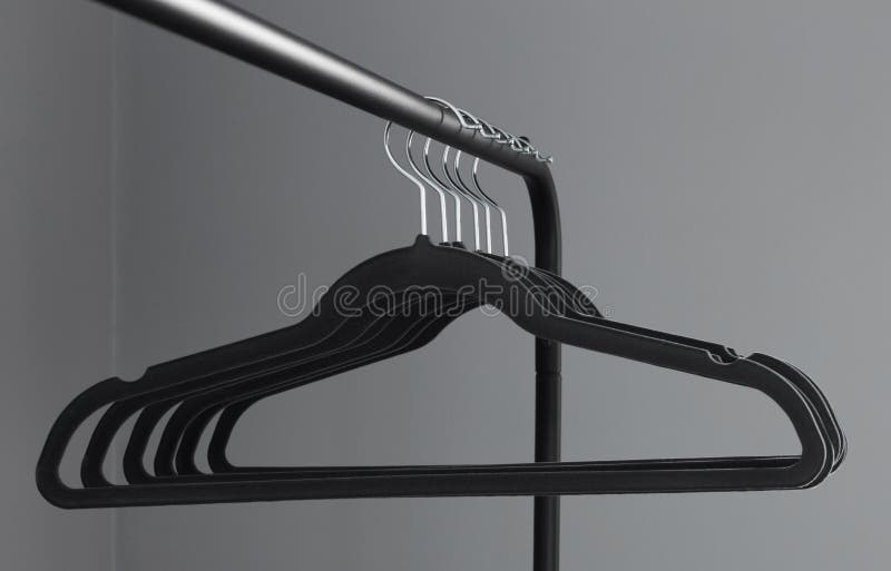Empty Clothes Hanger on Gray Wall Background Stock Photo - Image of ...
