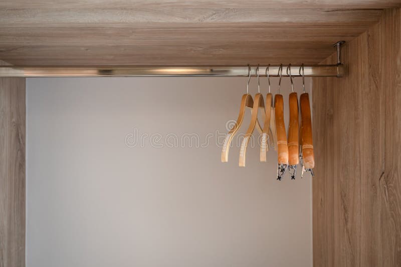 Empty Clothes Hanger on Stainless Rail in Closet Stock Photo - Image of ...