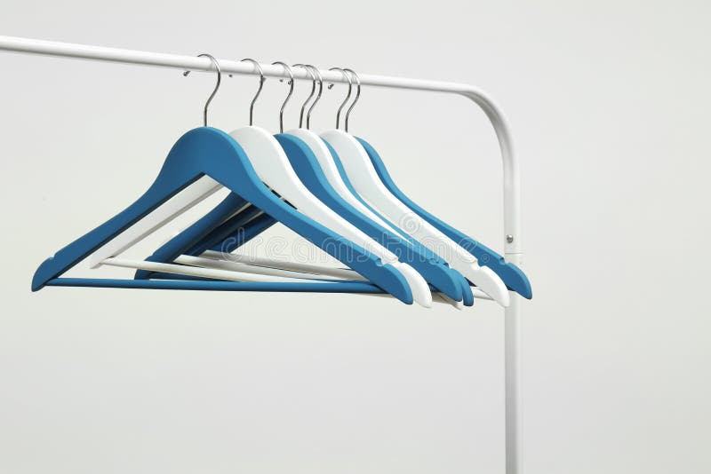 Rack With Empty Clothes Hanger On Color Wall. Wardrobe Accessory Stock ...